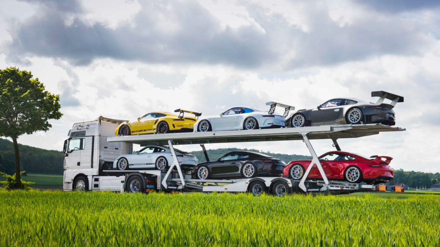Delivery-Mileage Porsche GT Collection, Plus Transport Truck, Offered ...